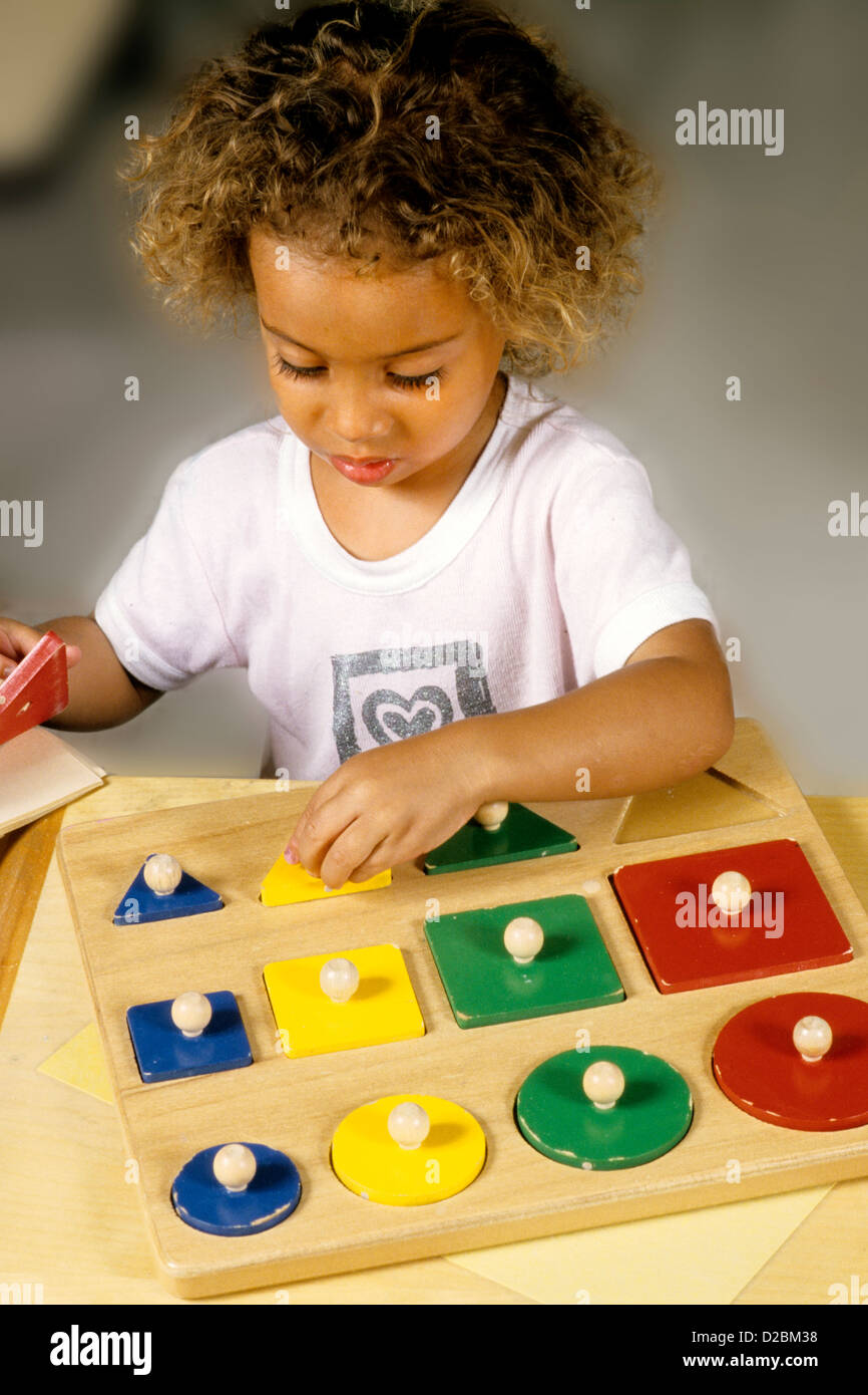 Girl working with blocks to learn shapes hi-res stock photography and ...