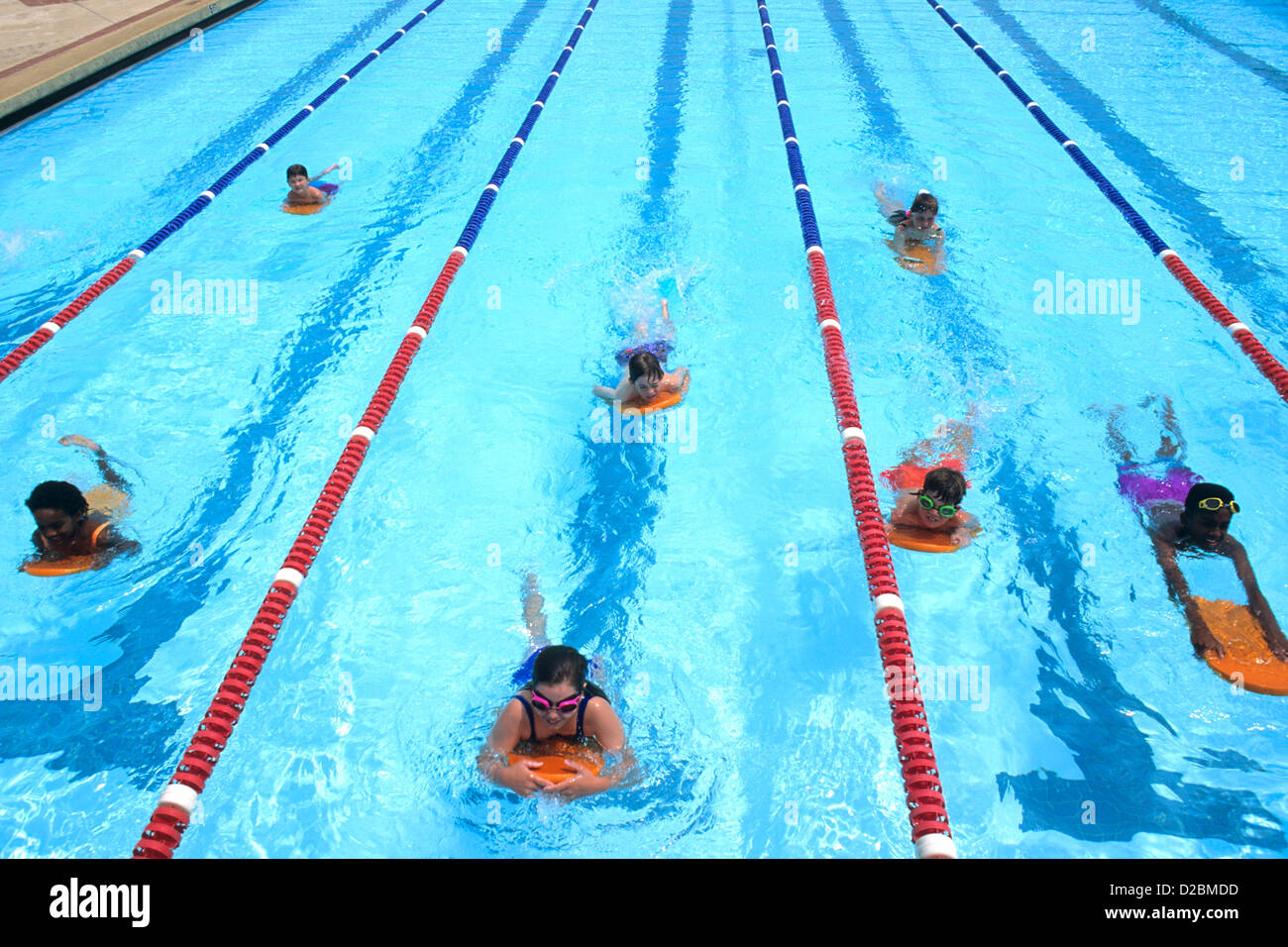 Children Learning How To Swim Stock Photo - Alamy