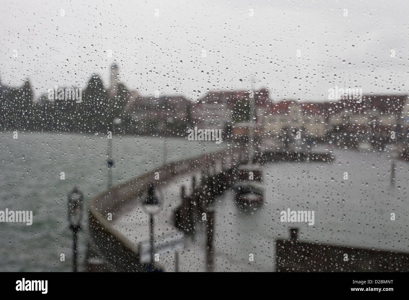 Harbor wall and building facades in the rain Stock Photo - Alamy