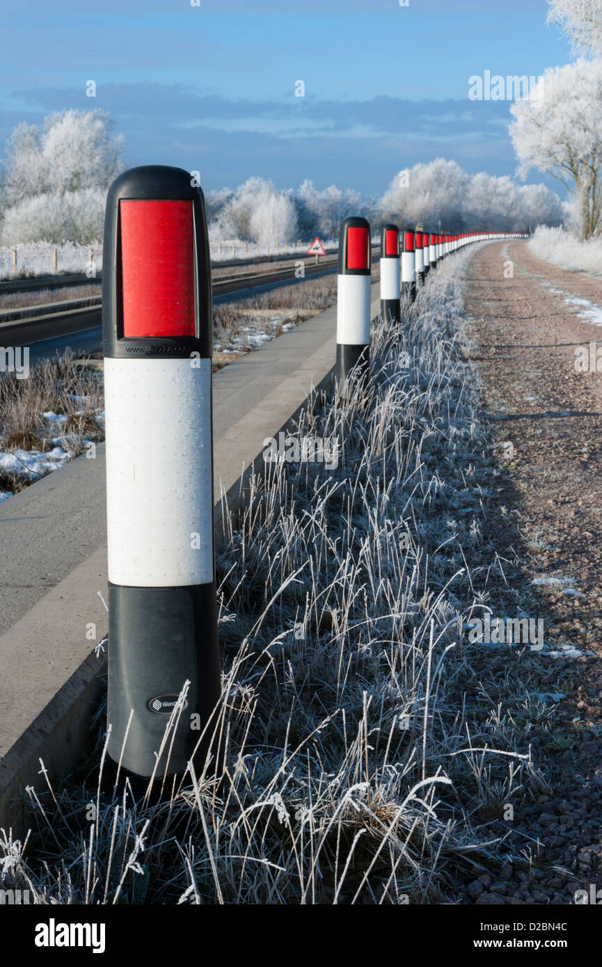 Bollards along edge of the guided busway or bus track between St Ives ...