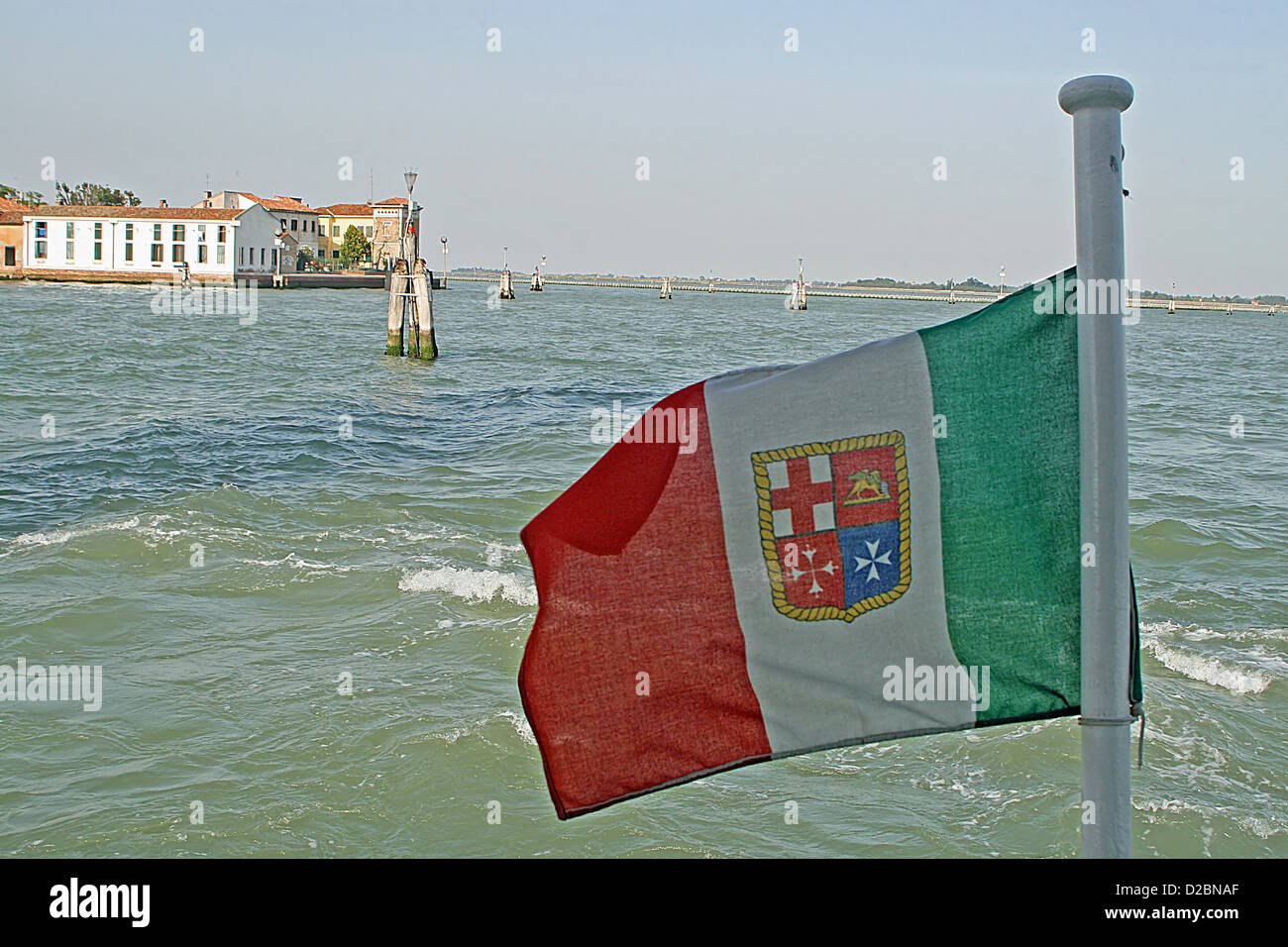Italian flag with the symbol of the sea waves from the stern of a ship ...