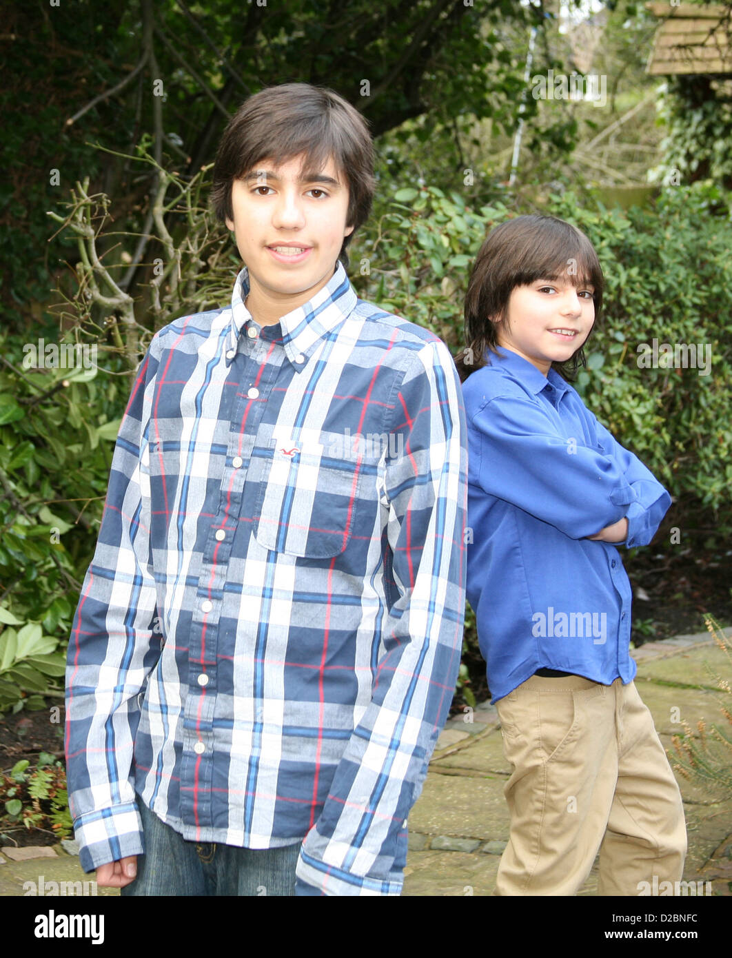 Portrait of confident smiling brunette brothers Stock Photo - Alamy