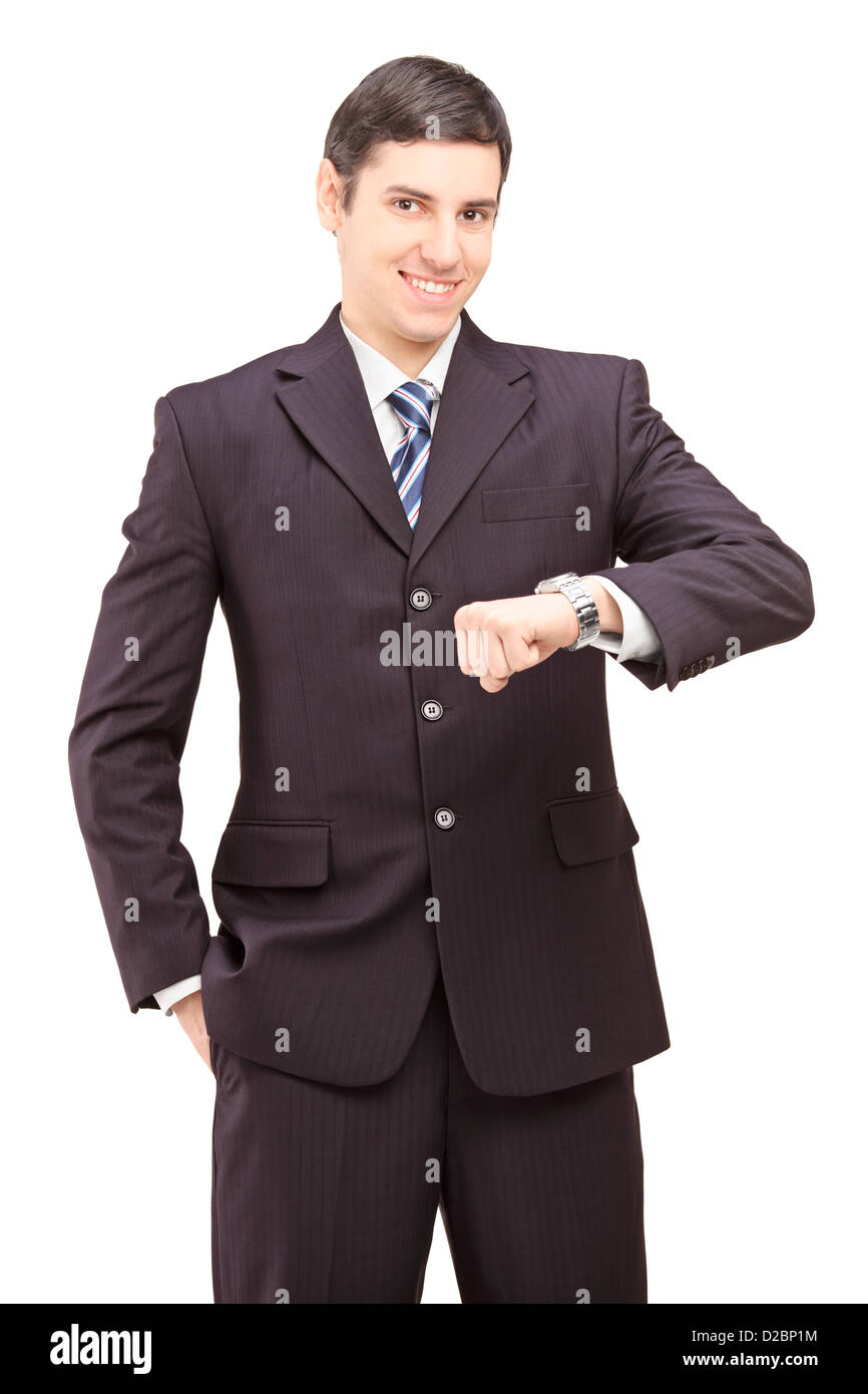 Handsome businessman looking at his watch isolated on white background ...