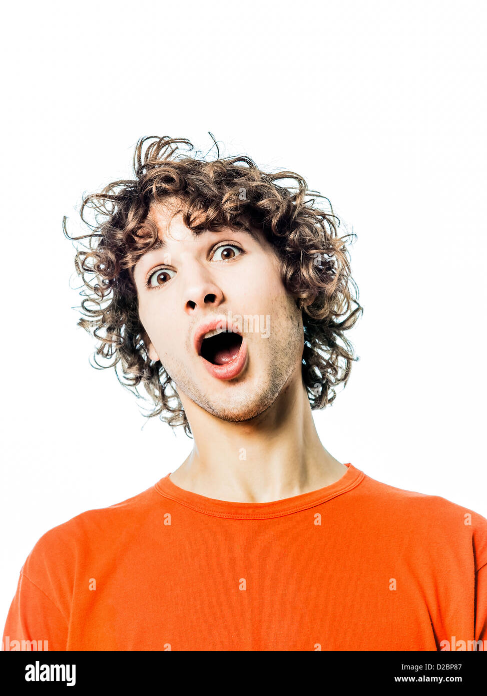 one young man surprised amazed portrait in studio white background ...
