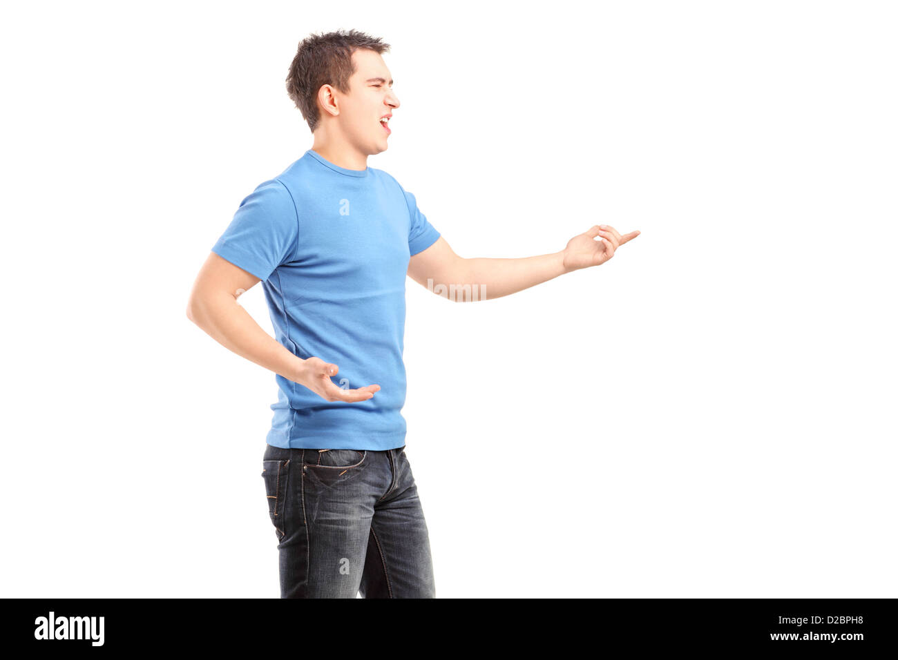 Young angry male pointing with finger isolated on white background ...