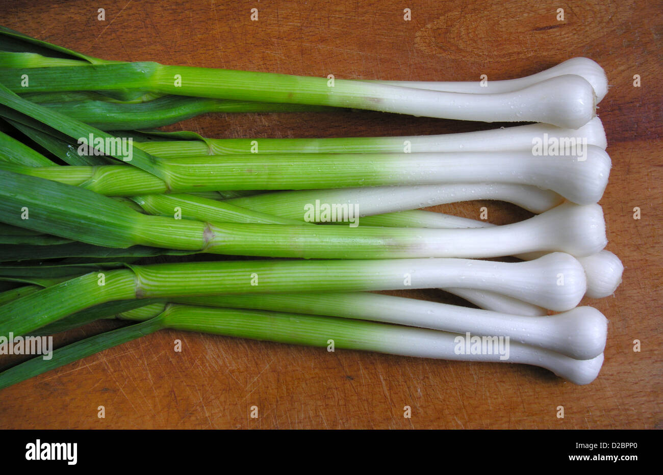 bunch of fresh green garlic on the cook-table Stock Photo - Alamy