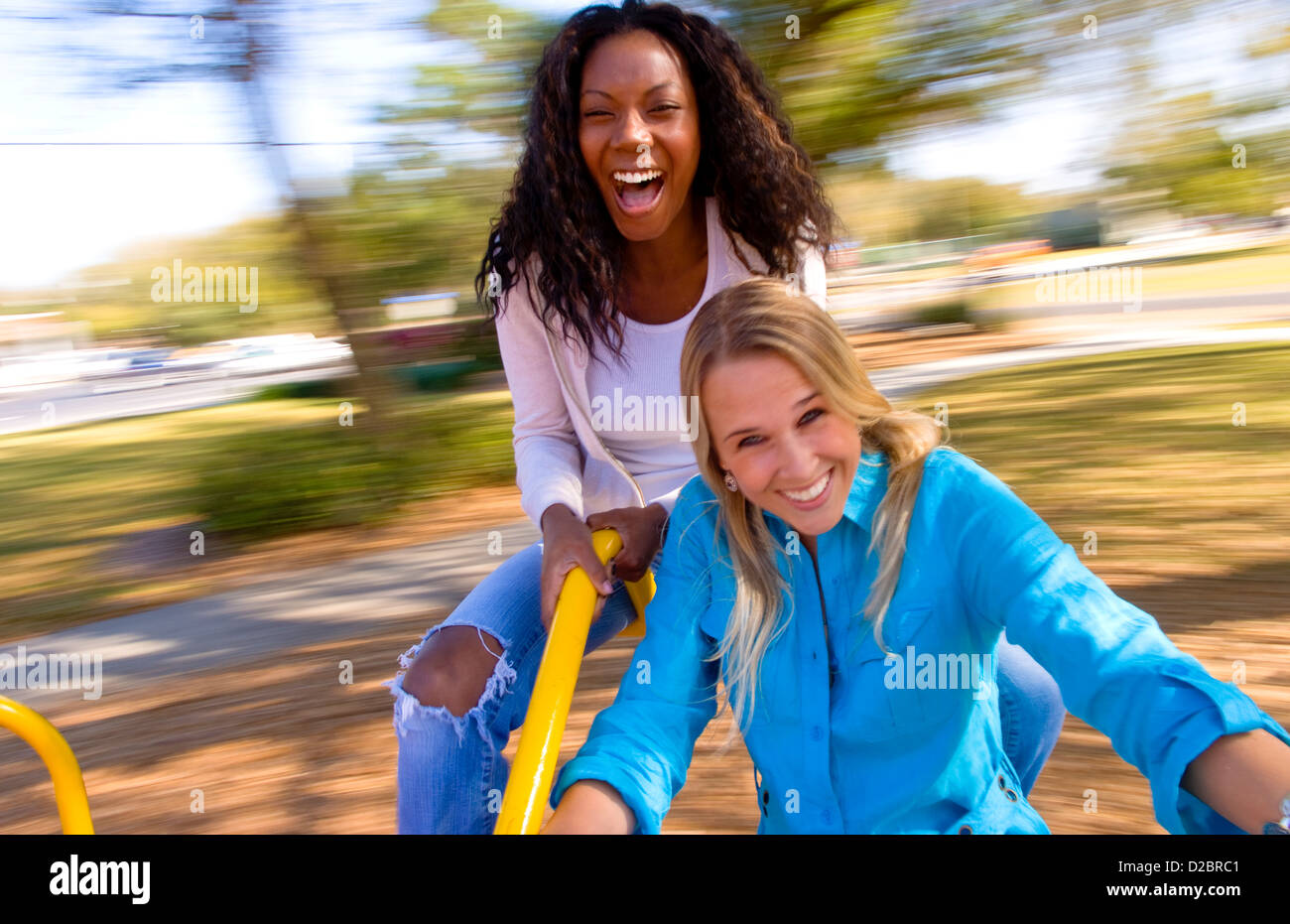 Women in their 20s on a merry go round hi-res stock photography and ...