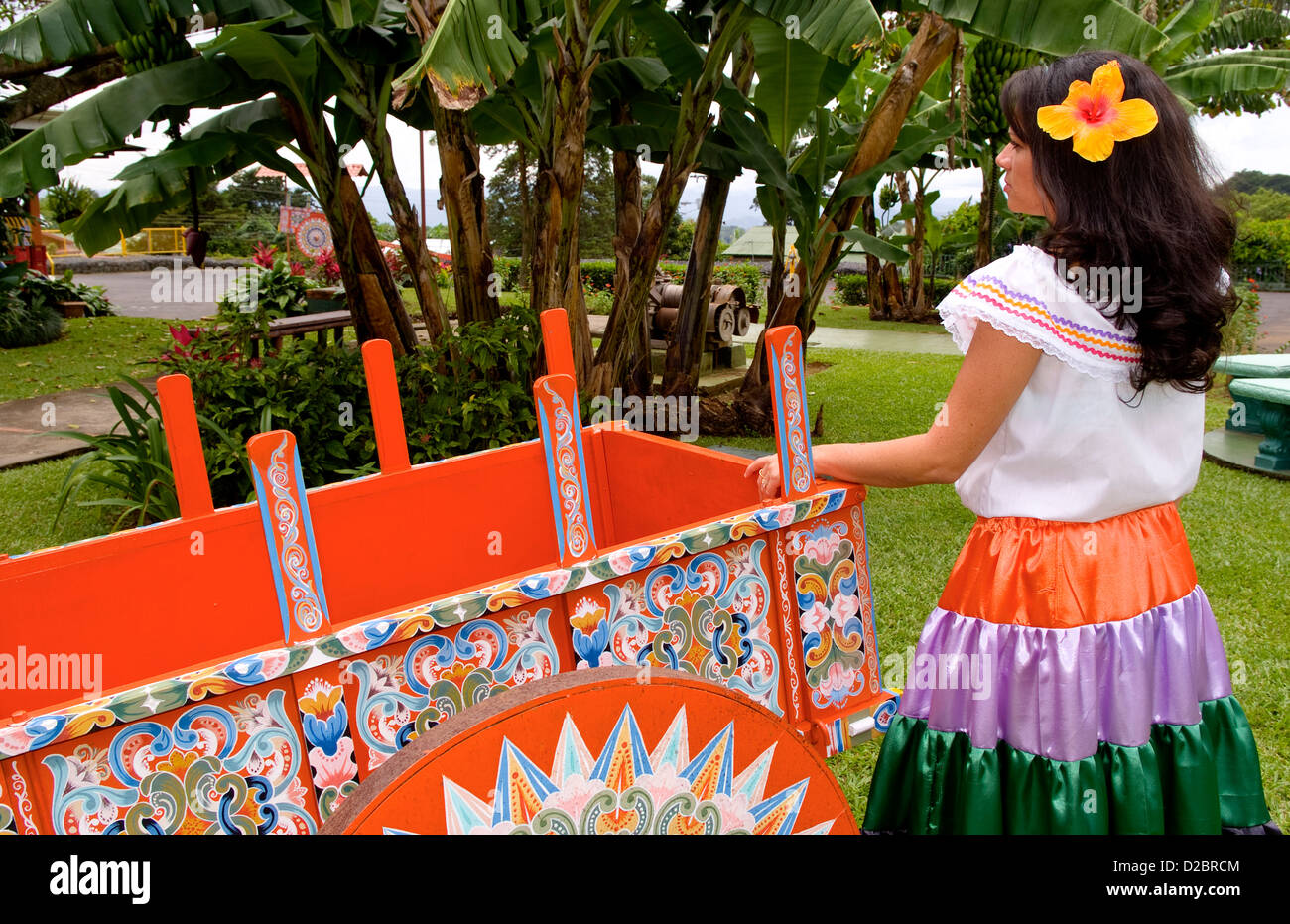 Costa Rican Woman In Traditional Dress Next To Traditional Carriage In ...