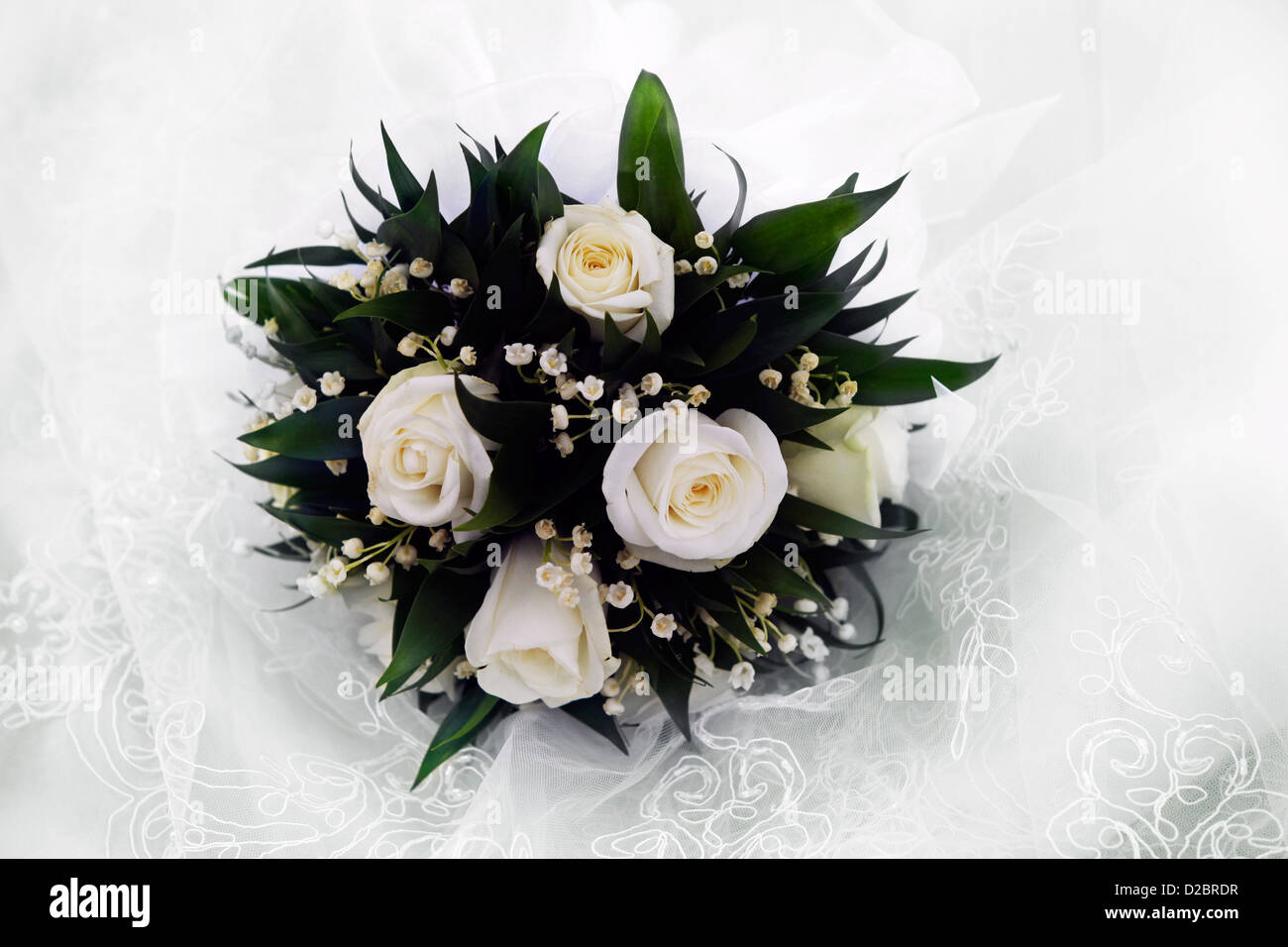Wedding bouquet on a background of a veil Stock Photo - Alamy