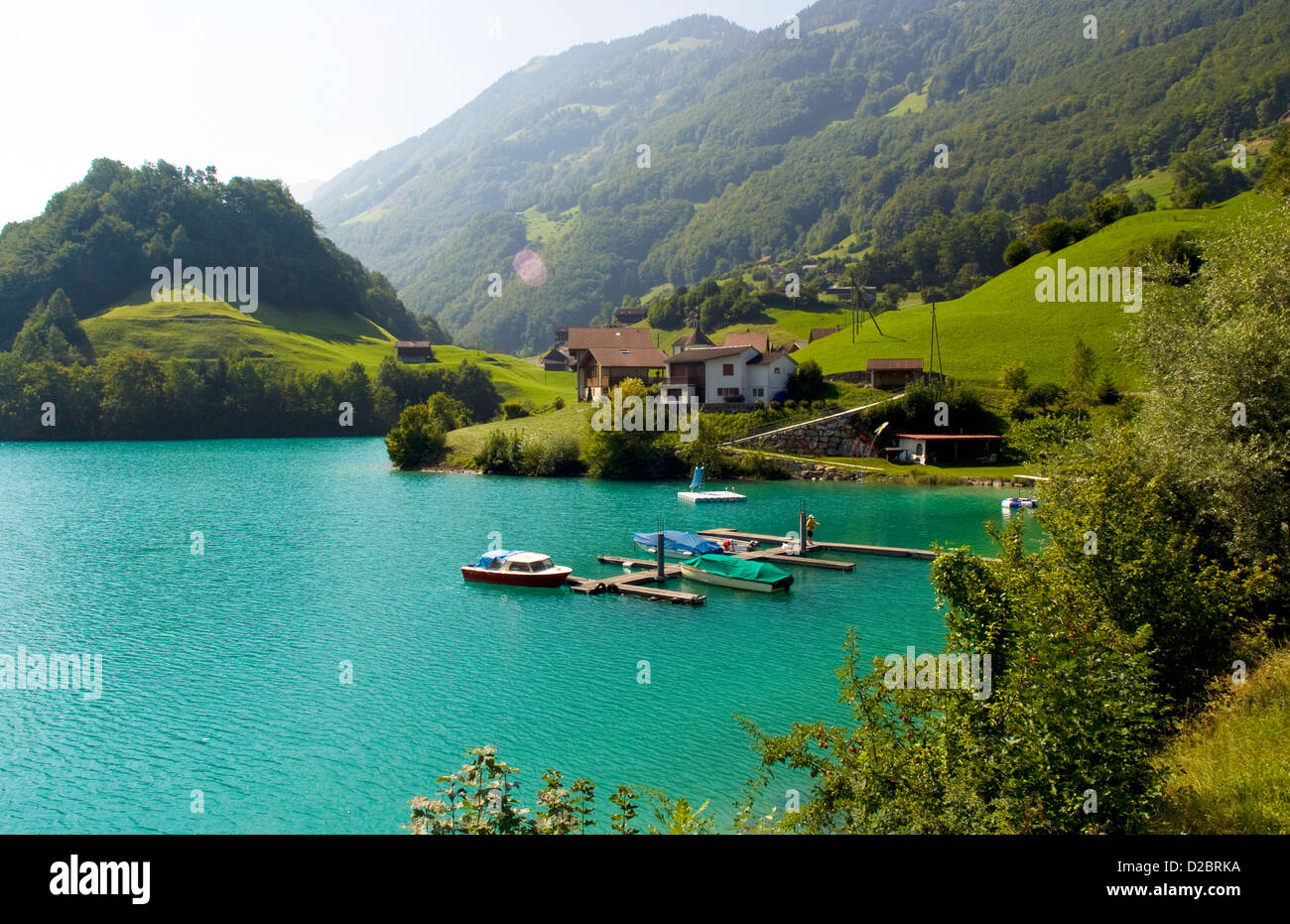Boats On Lake In The Swiss Alps In Burgen Near Interlaken, Switzerland ...