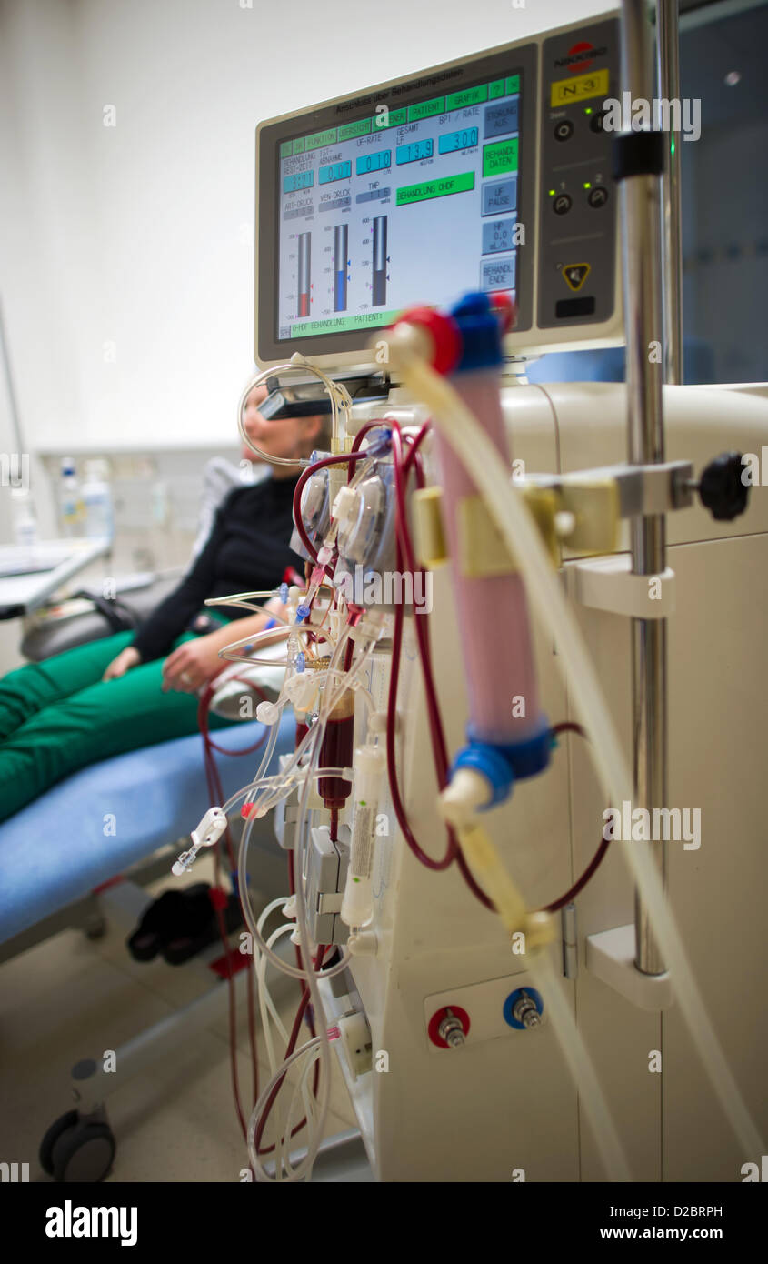 A dialysis patient is connected to a dialysis machine for blood ...