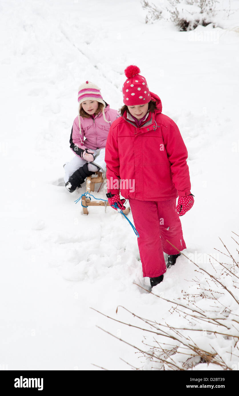 Children with sled hi-res stock photography and images - Alamy