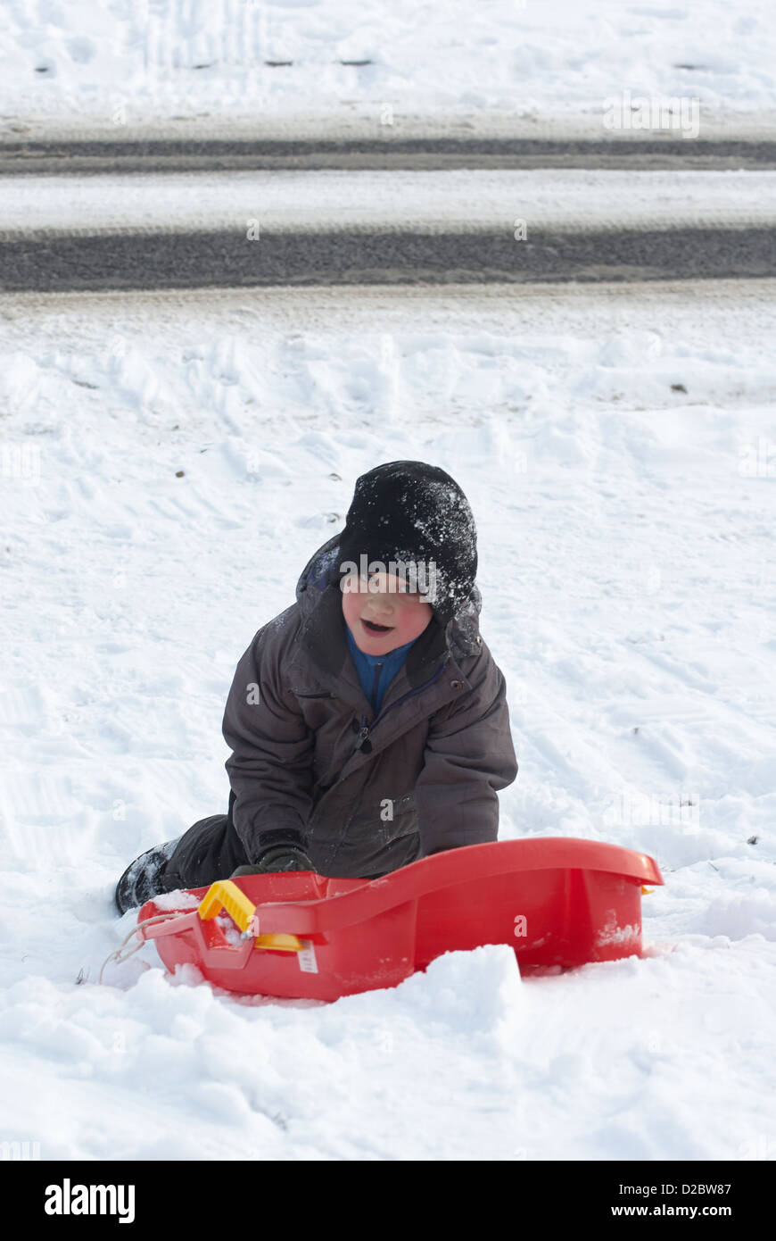 Child Boy (6-8) on a bob sledge, snow, wintertime Stock Photo - Alamy