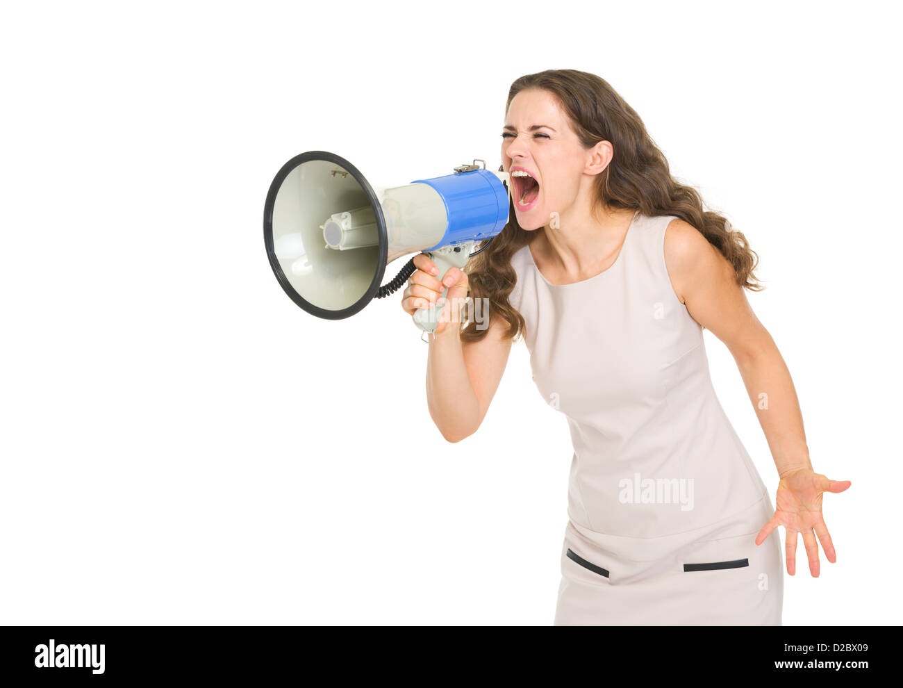 Angry young woman shouting thought megaphone Stock Photo - Alamy