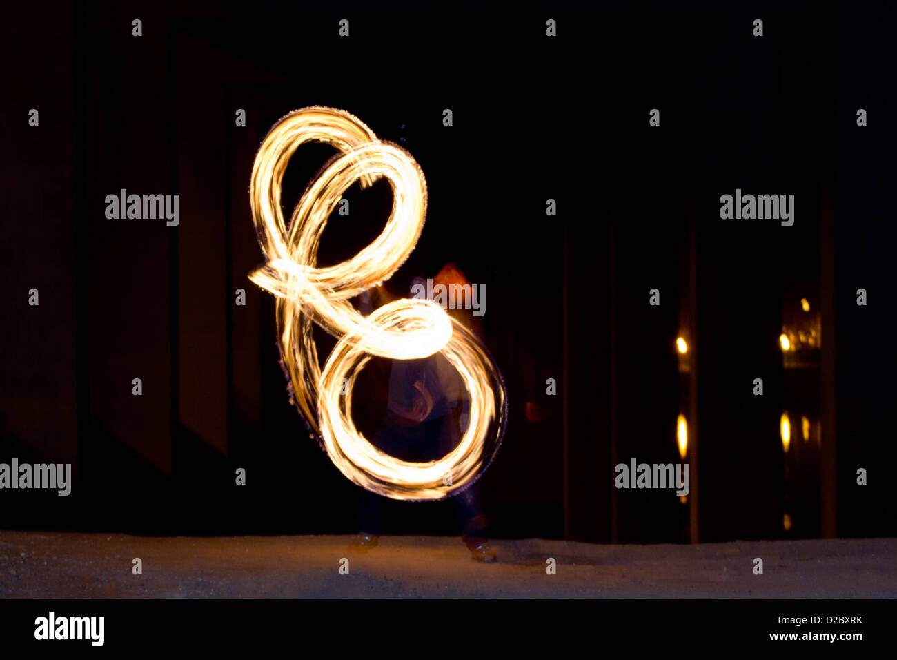 Fire spinners using fire hula hoops Stock Photo - Alamy