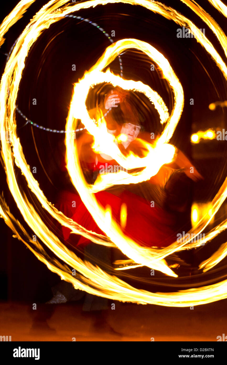 Fire spinners using fire hula hoops Stock Photo - Alamy