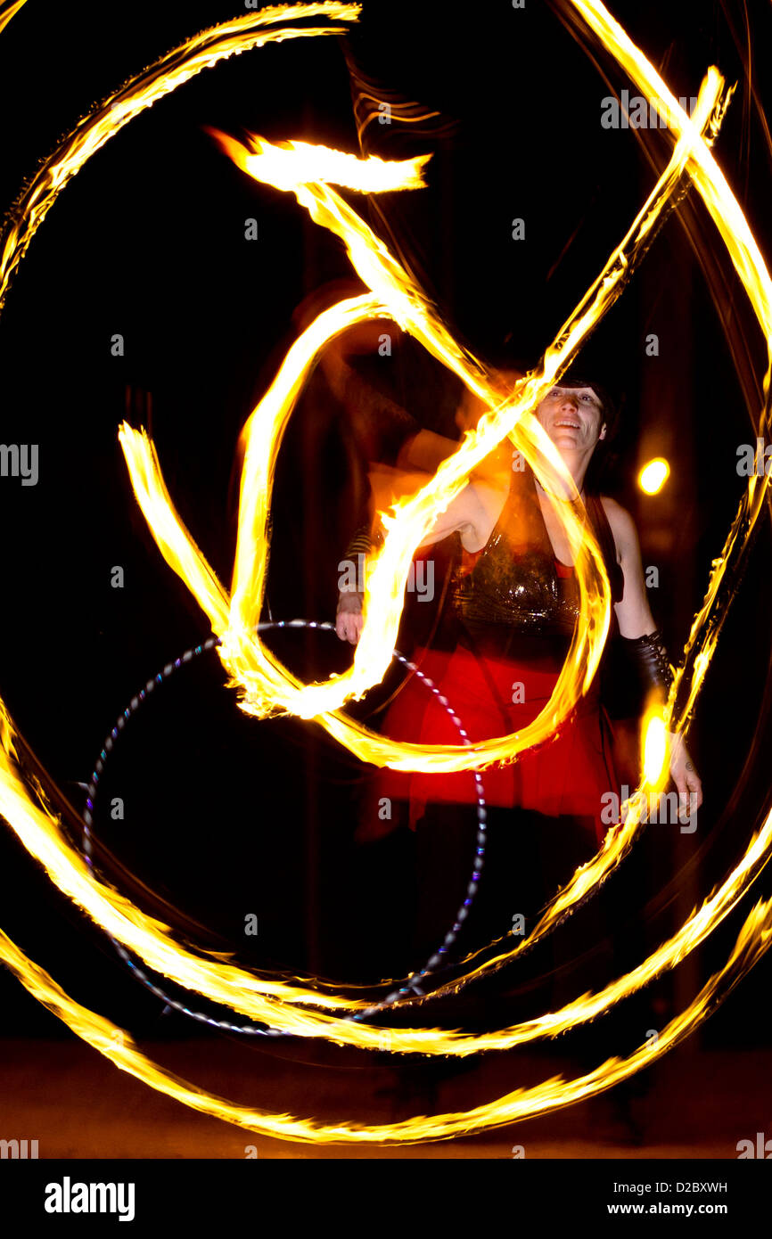 Fire spinners using fire hula hoops Stock Photo - Alamy