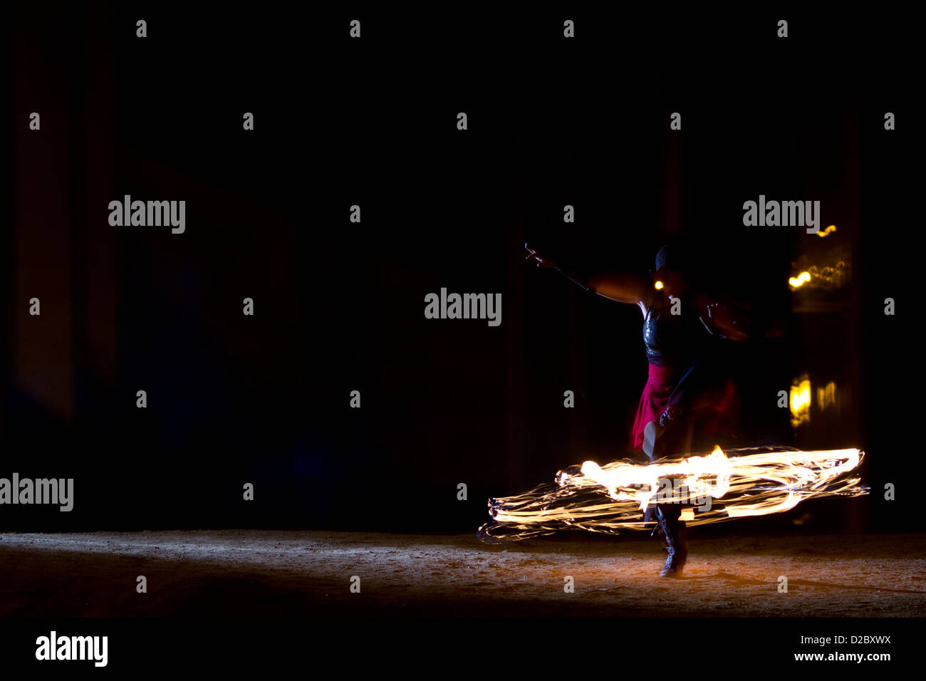 Fire spinners using fire hula hoops Stock Photo - Alamy