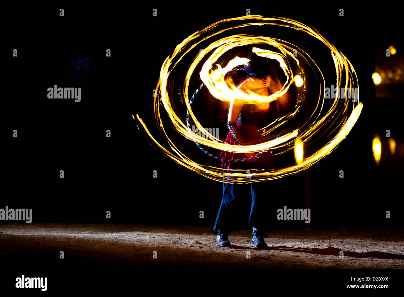 Fire spinners using fire hula hoops Stock Photo - Alamy
