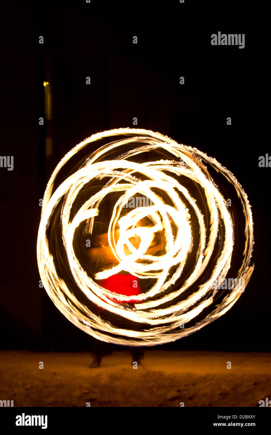 Fire spinners using fire hula hoops Stock Photo - Alamy