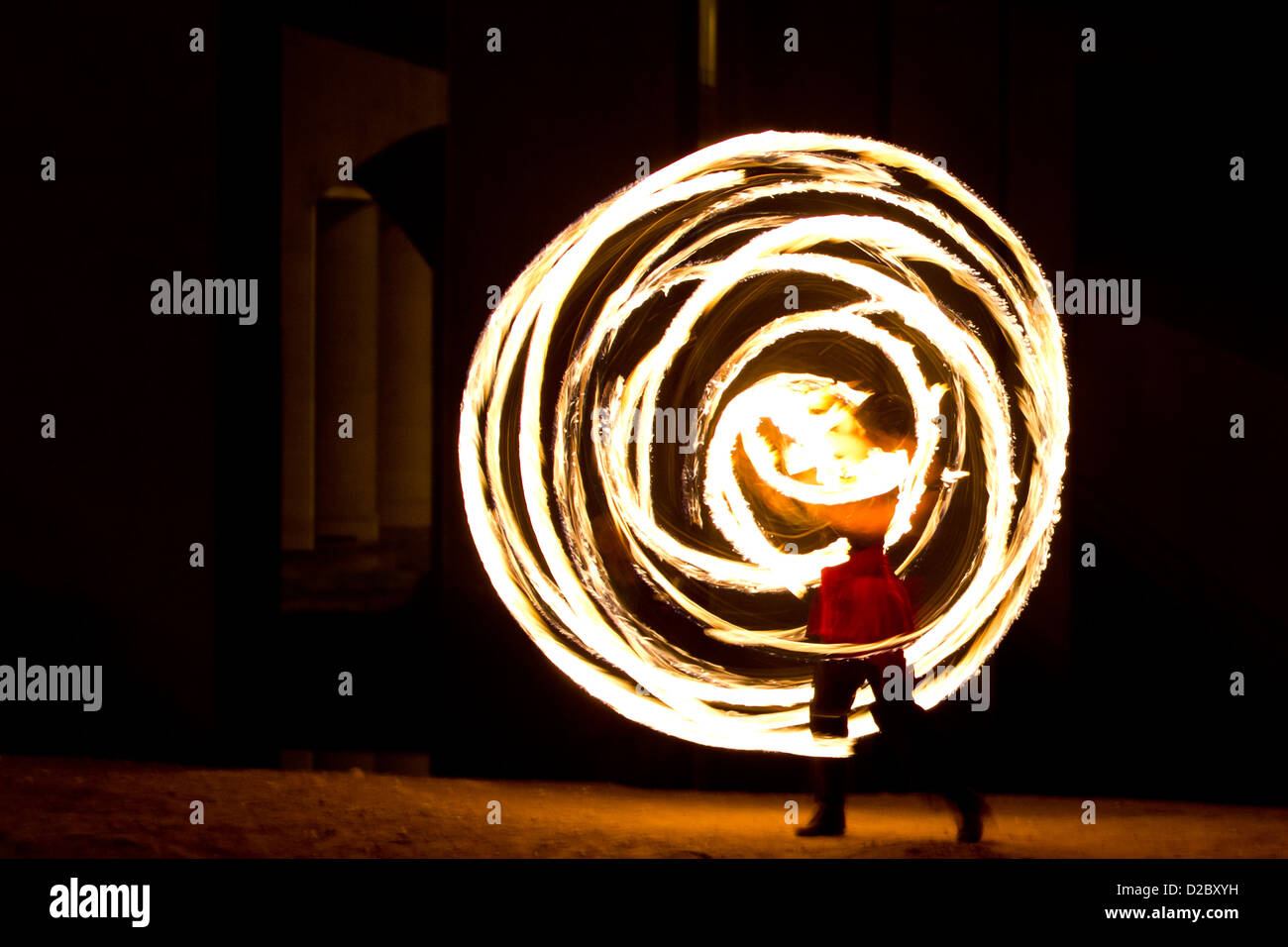 Fire spinners using fire hula hoops Stock Photo - Alamy