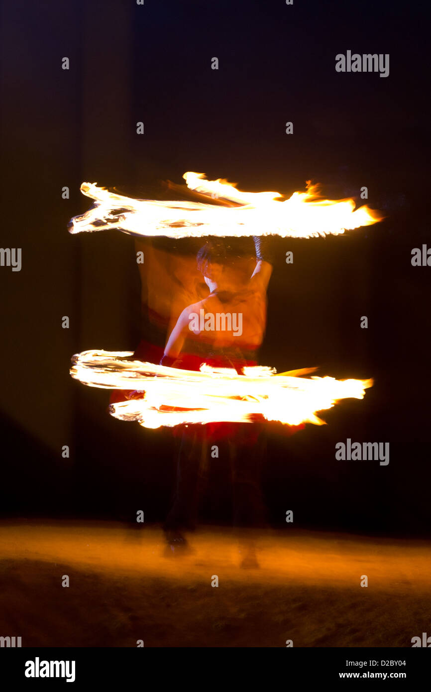 Fire spinners using fire hula hoops Stock Photo - Alamy