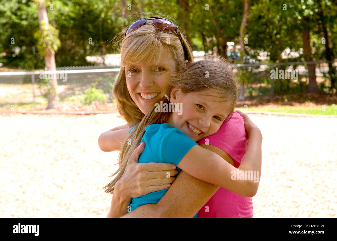 Mother And Daughter Hugging Stock Photo - Alamy