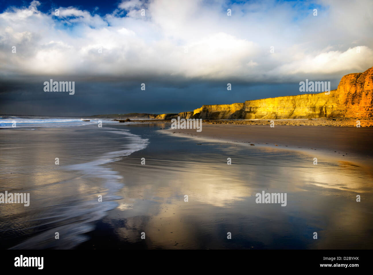Low tide reflections in the sand at Monknash beach Stock Photo - Alamy