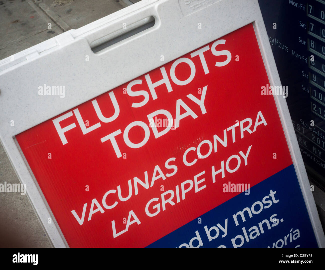A Sign In English And Spanish Advertises That Flu Shots Are Available a-sign-in-english-and-spanish-advertises-that-flu-shots-are-available