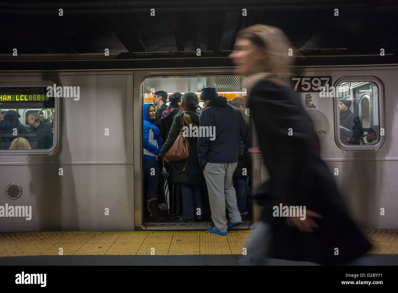 Passengers crowd into a subway train during rush hour in New York on ...