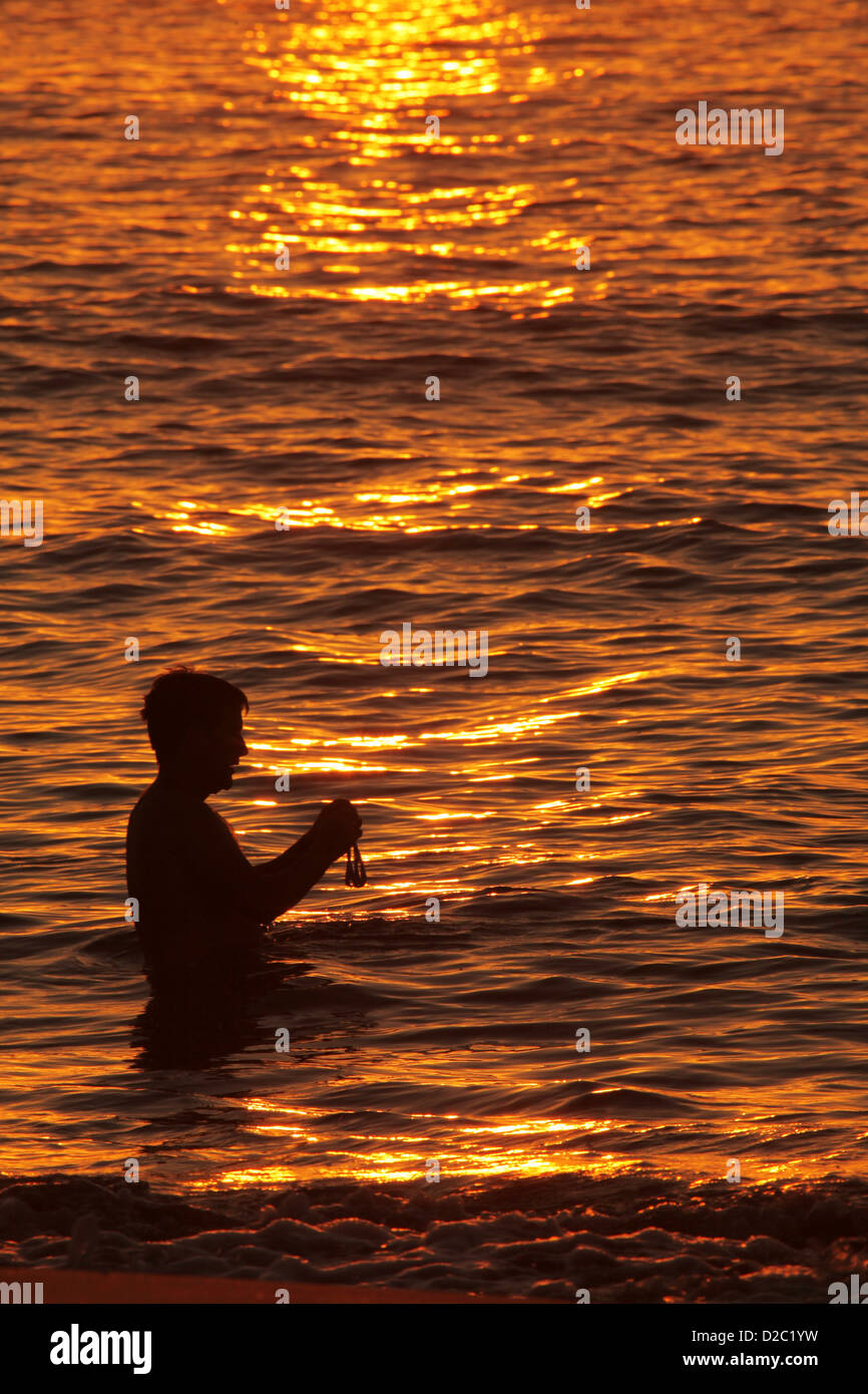 Swimmer having an early morning dip during the sunrise at Sydney's ...