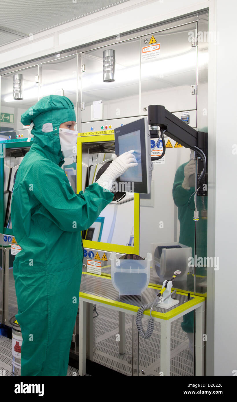 Duisburg, Germany, a micro technologist working in the clean room at ...