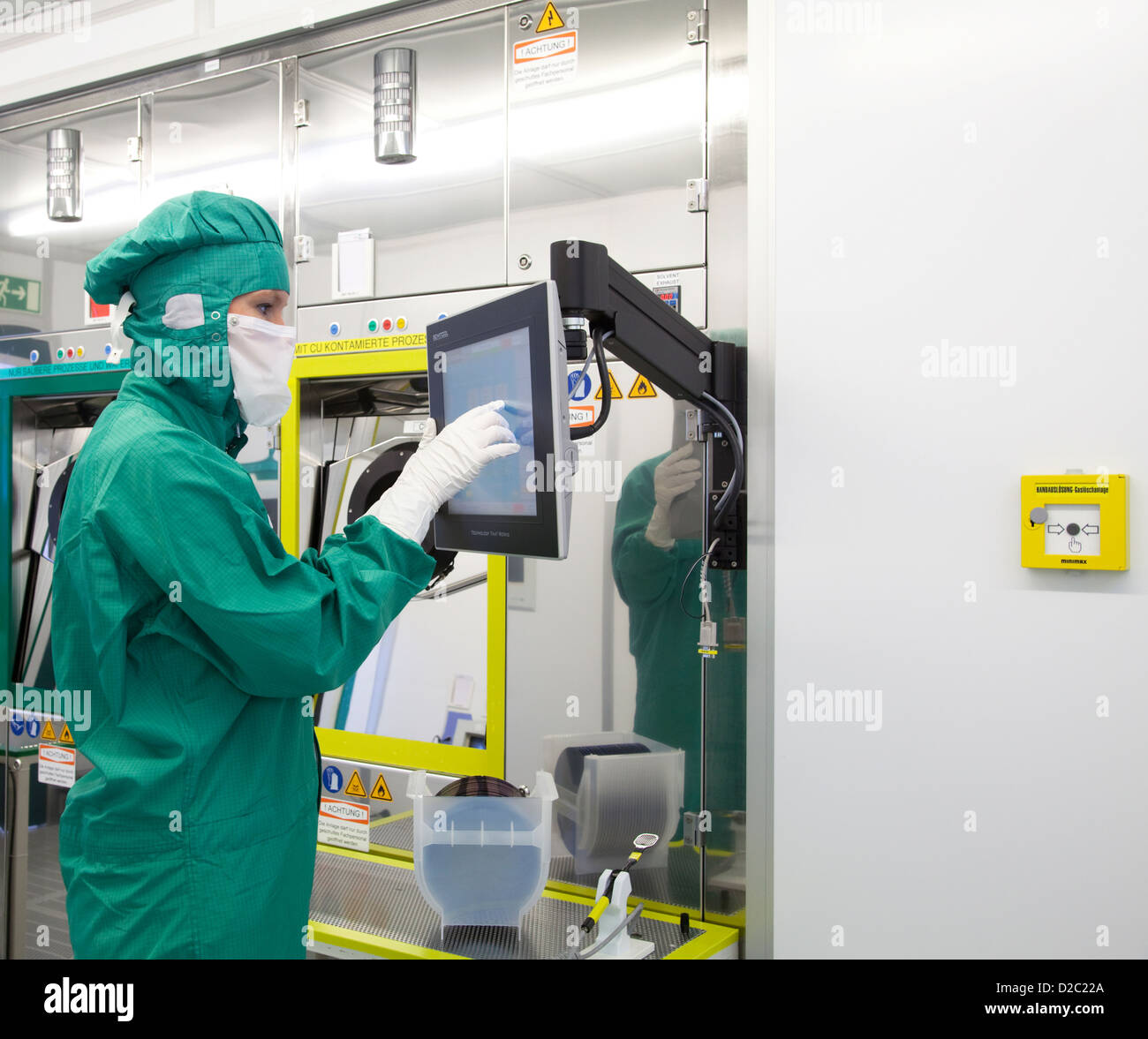 Duisburg, Germany, a micro technologist working in the clean room at ...