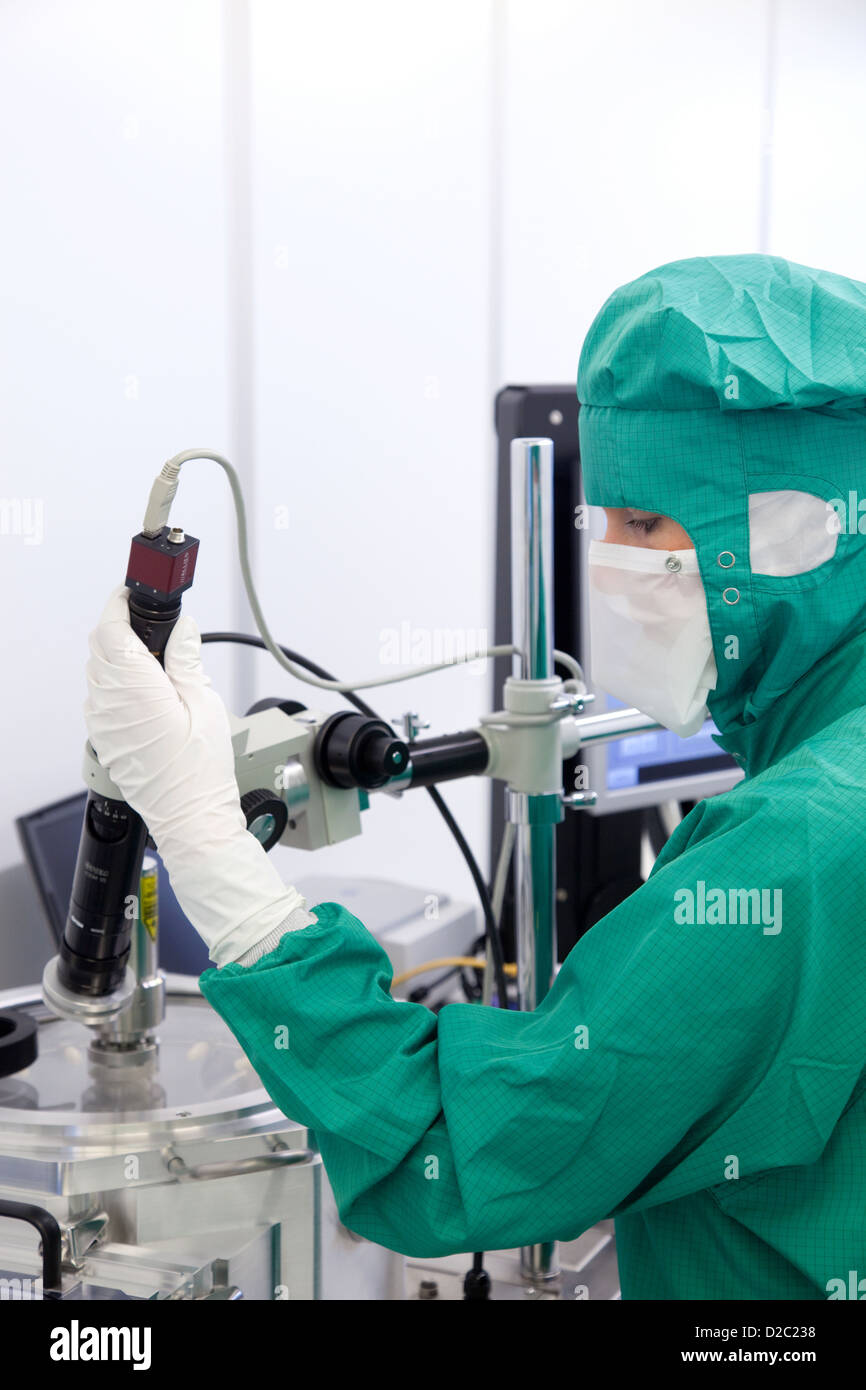 Duisburg, Germany, a micro technologist working in the clean room at ...