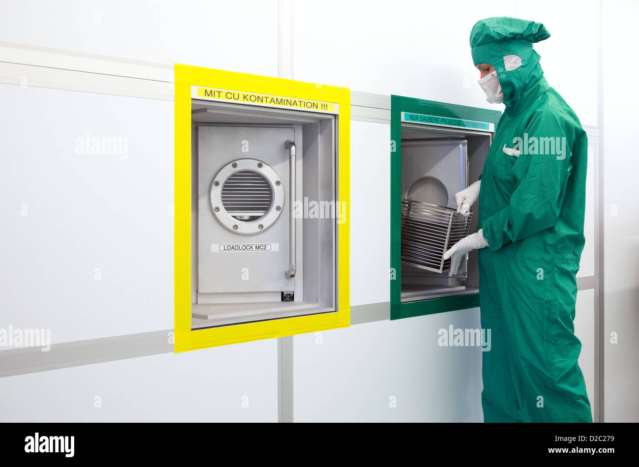 Duisburg, Germany, a micro technologist working in the clean room at ...