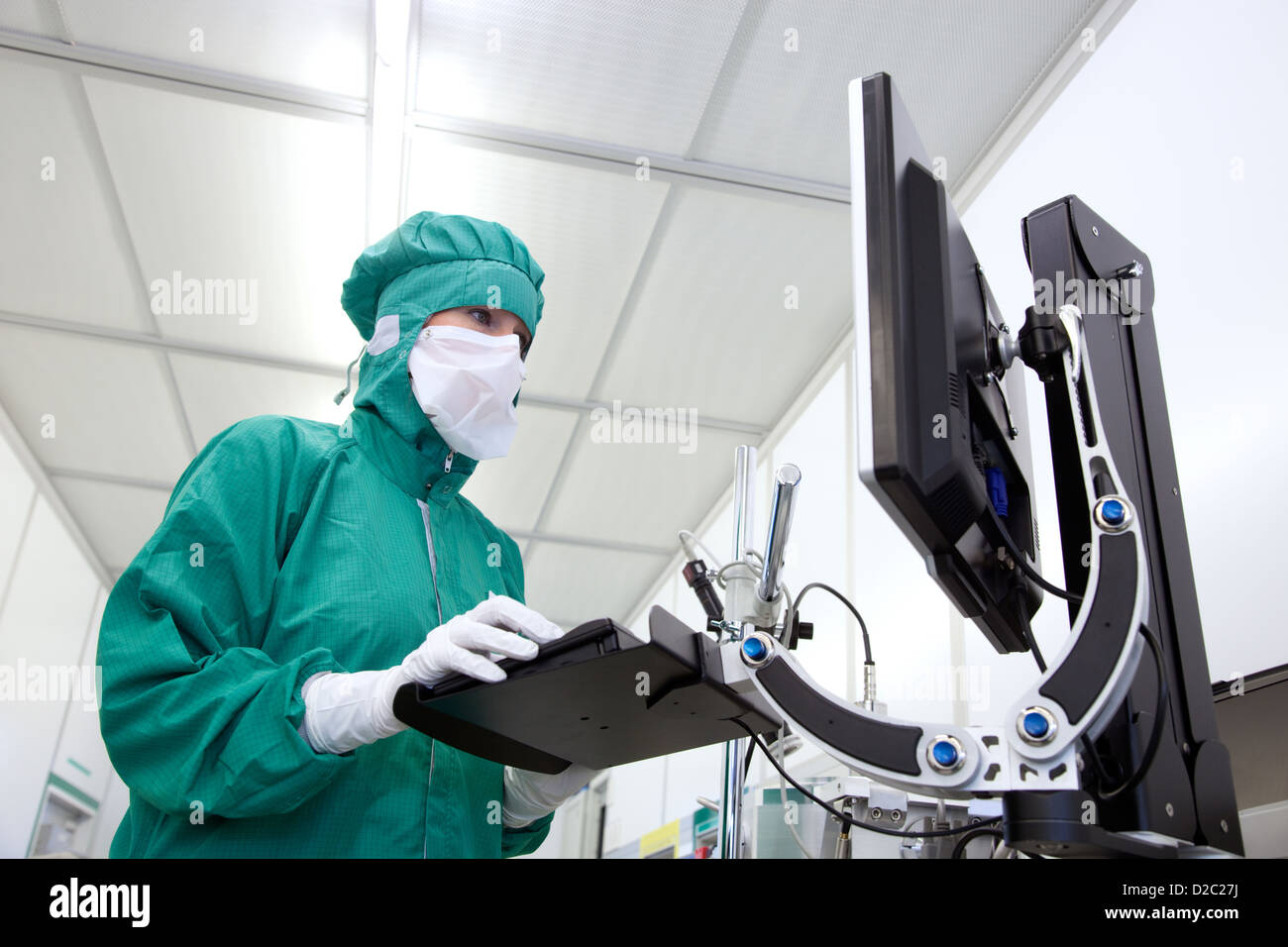 Duisburg, Germany, a micro technologist working in the clean room at ...