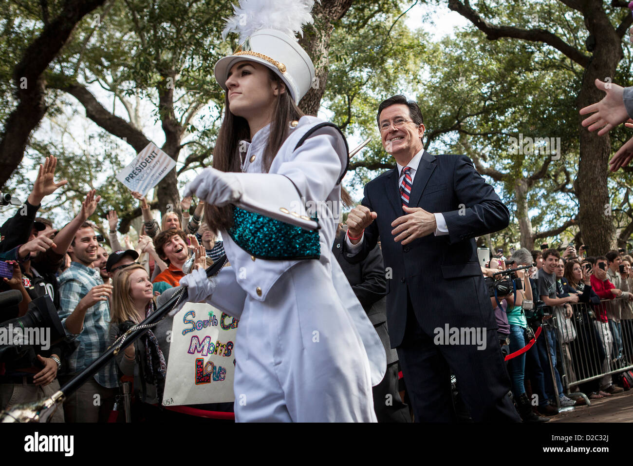 Comedian Stephen Colbert marches into a rally with former Republican ...
