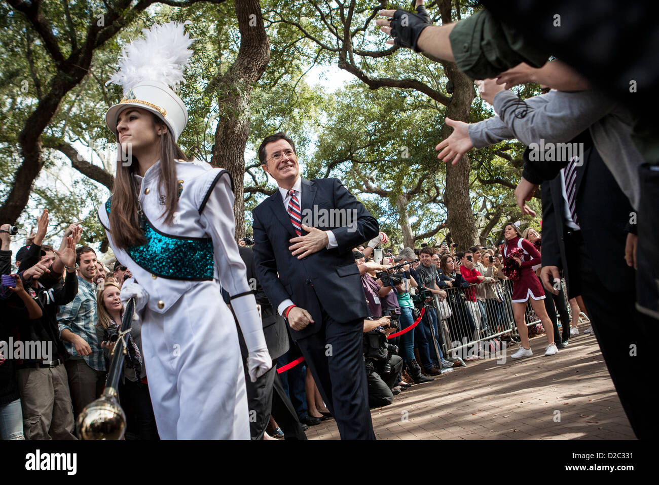 Comedian Stephen Colbert marches into a rally with former Republican ...