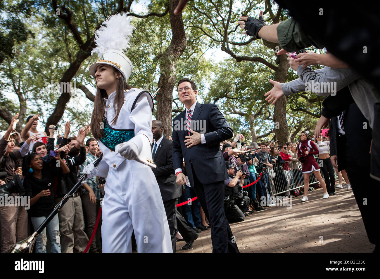 Comedian Stephen Colbert marches into a rally with former Republican ...
