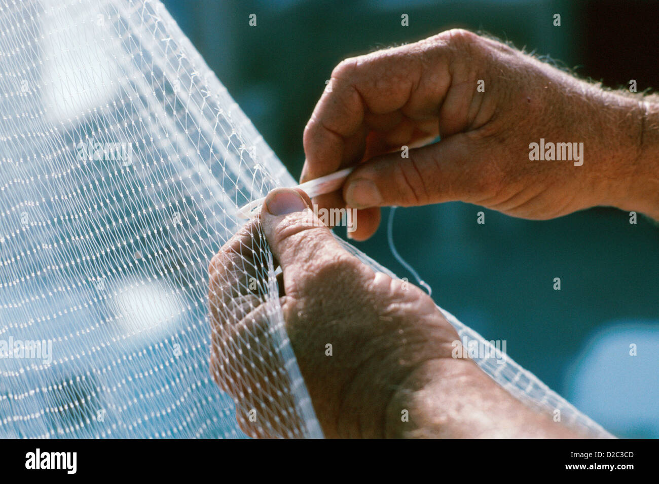 Hands Repairing Netting Stock Photo - Alamy