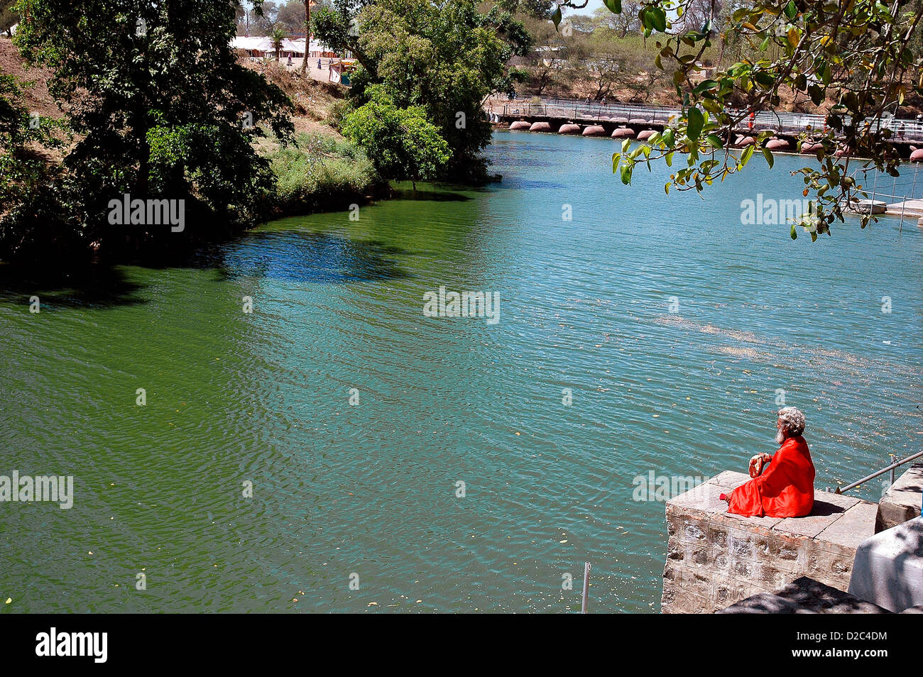 Indian Priest Sadhu Meditating On Calm River Bank Stock Photo - Alamy