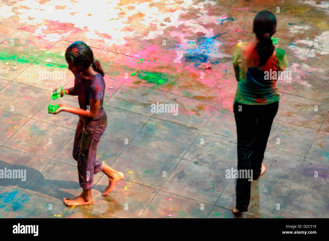 Two indian girls playing holi hi-res stock photography and images - Alamy