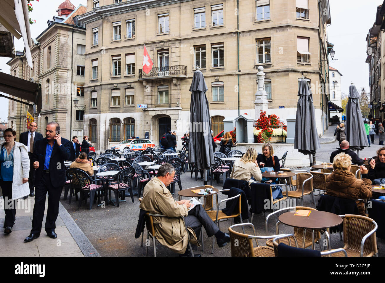 People sitting at the terrace cafes of Place du Bourg-de-Four, Geneva’s ...