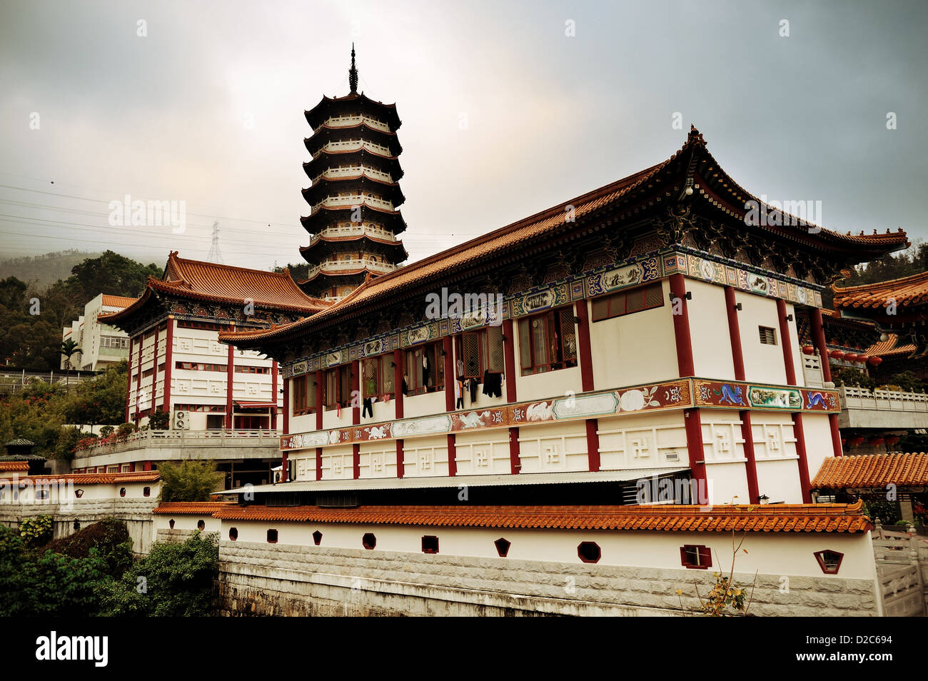 Chinese temple in Hong Kong with pagoda style architecture and tower ...