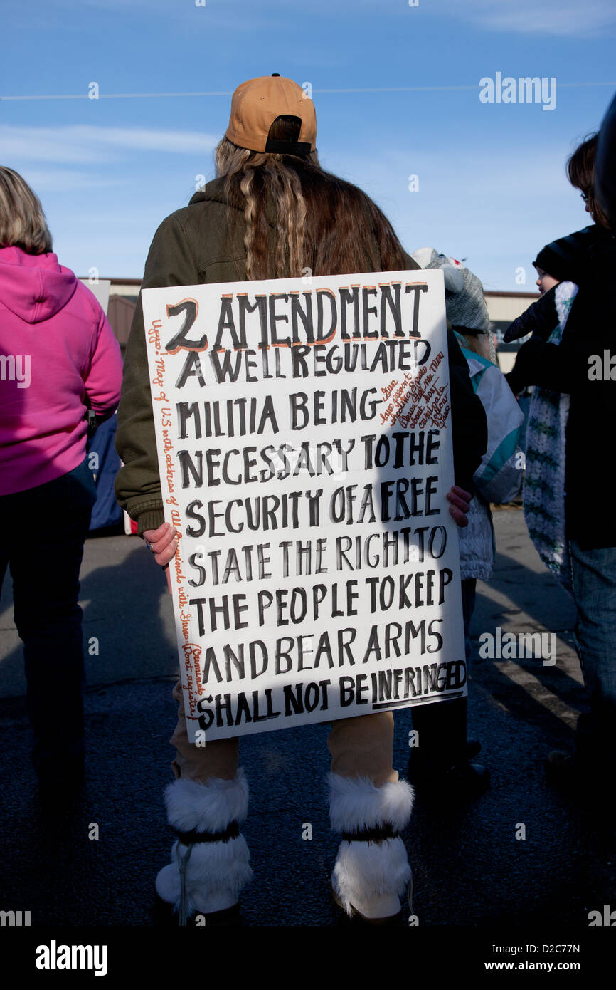 Woman holds rally sign Stock Photo - Alamy