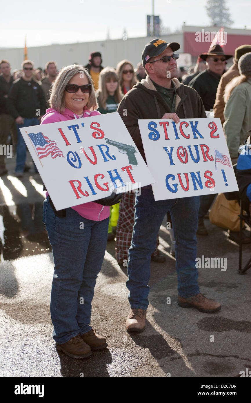 Couple holds signs at rally Stock Photo - Alamy