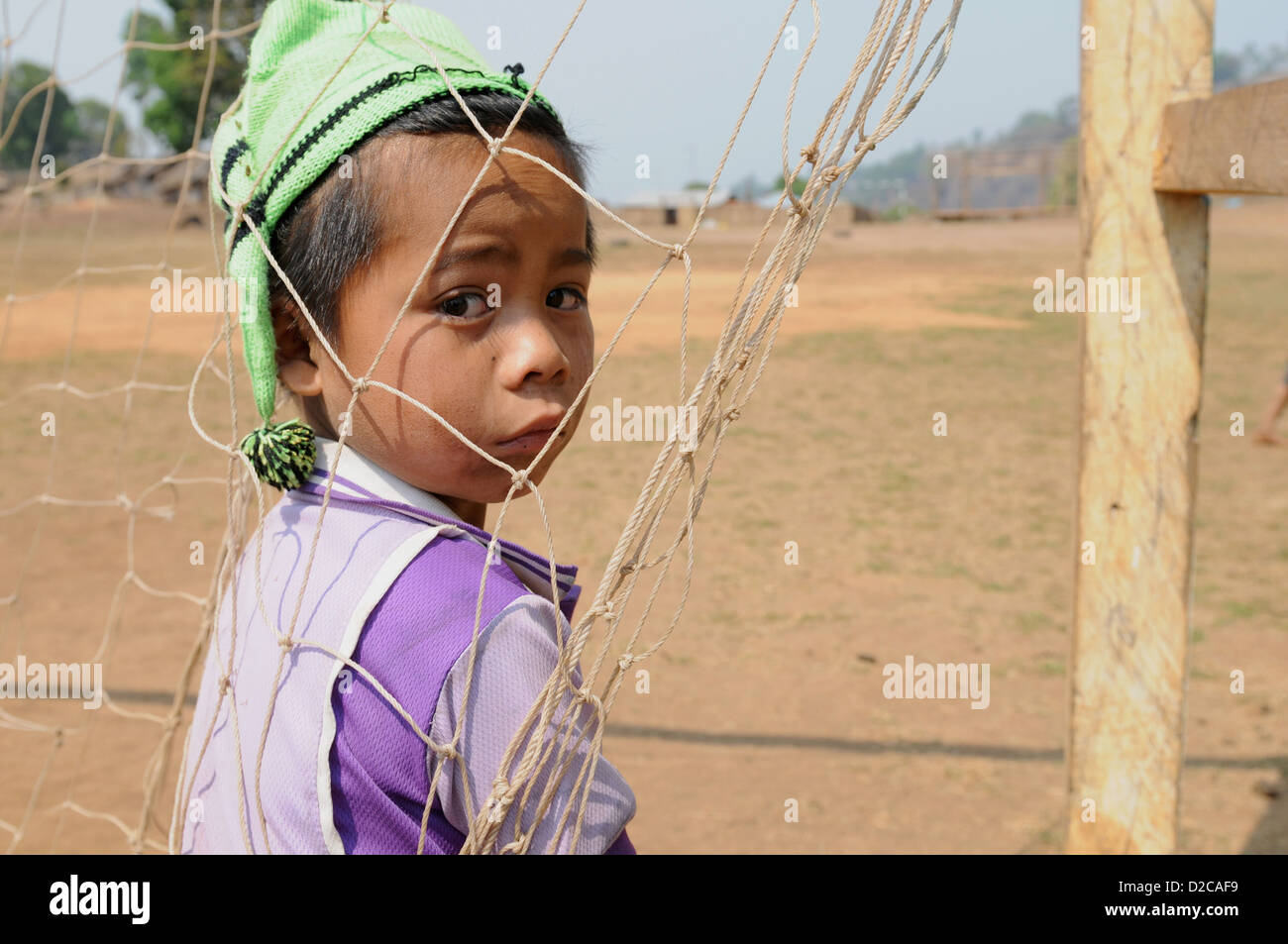 Taunggyi, Myanmar, Fluechtlingsjunge on a makeshift football field goal ...