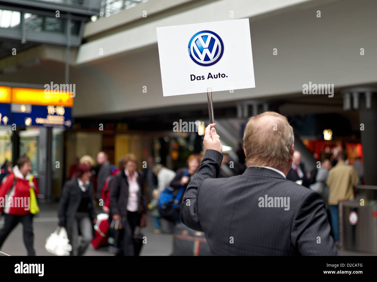 Berlin, Germany, the man holds up a sign with VW logo Stock Photo - Alamy