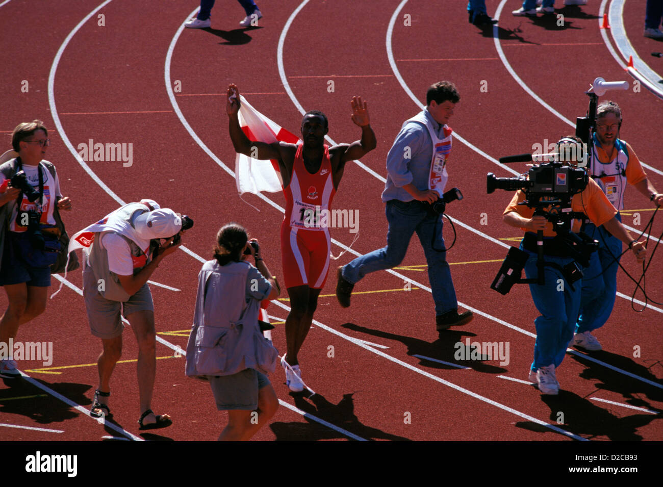 Track And Field, Running Through Finish Line Stock Photo - Alamy