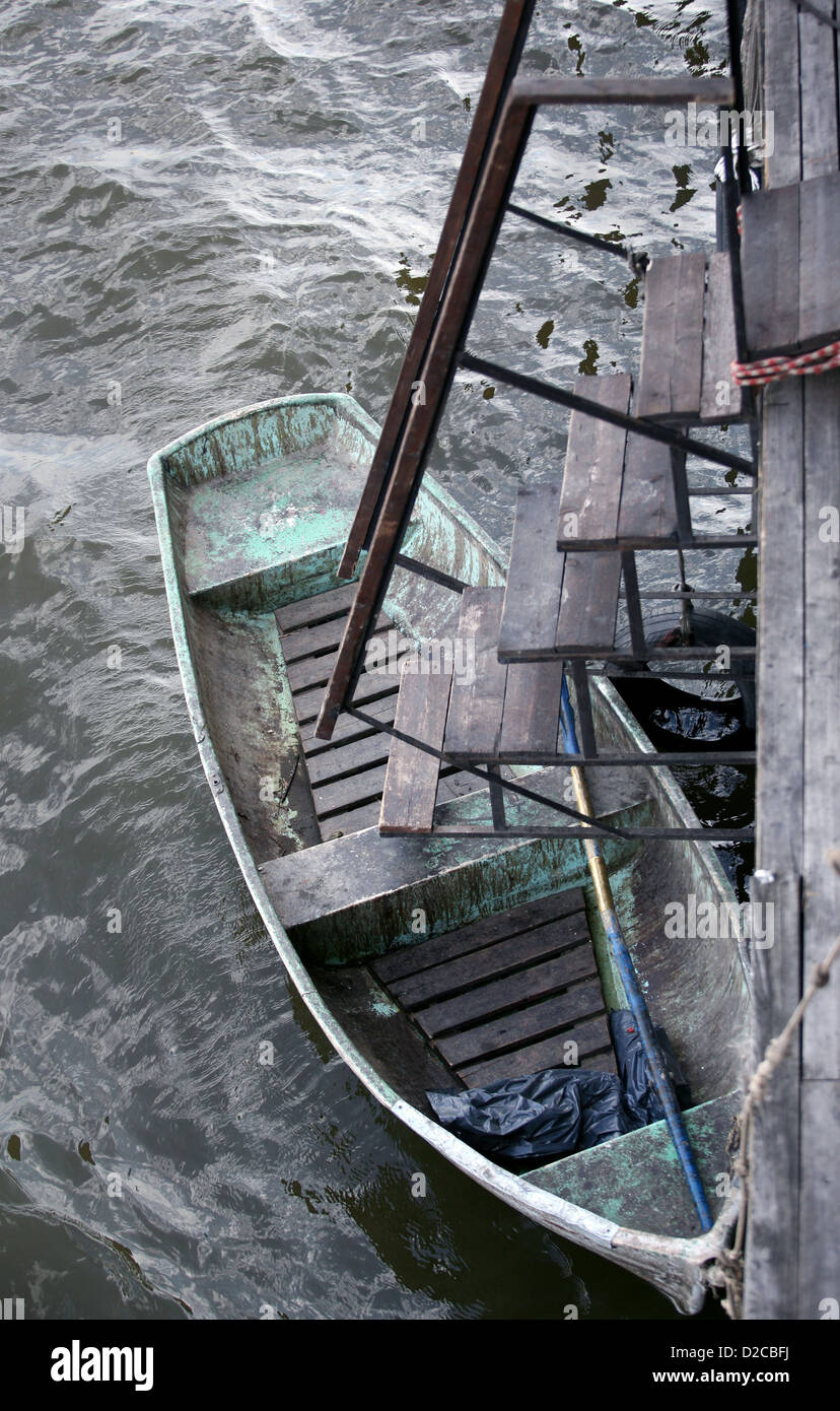 Rowing a boat in water and an iron ladder Stock Photo - Alamy